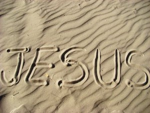 Gina Burgess photo words Jesus written in sand - LivingBetter50